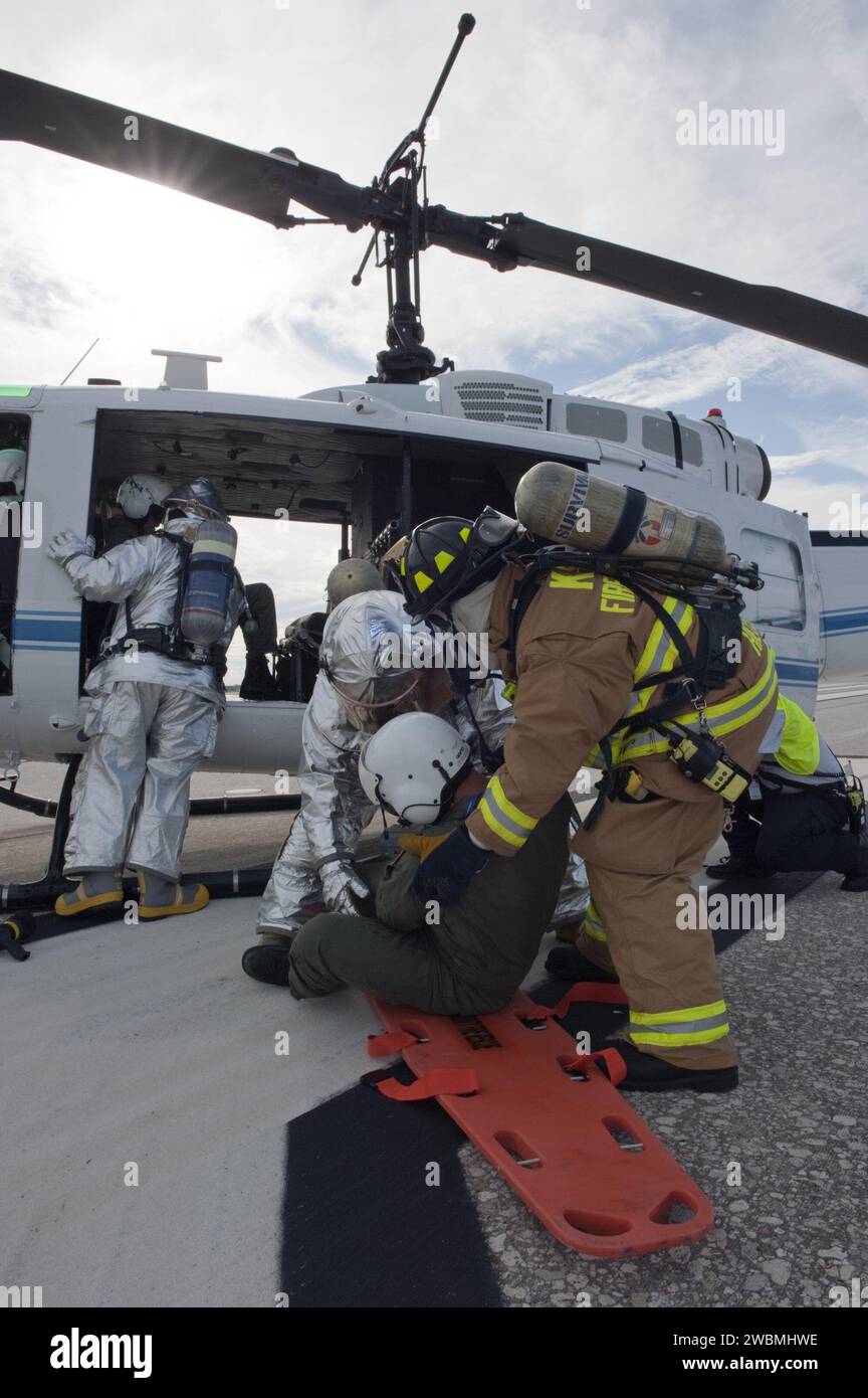 CAPE CANAVERAL, Fla. -- NASA Fire Rescue personnel assist volunteers ...