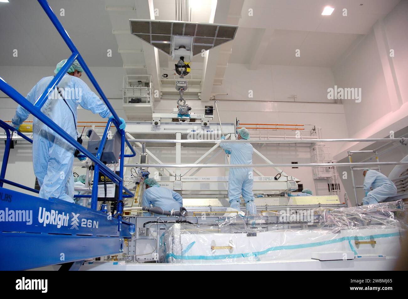 KENNEDY SPACE CENTER, FLA. - In the Space Station Processing Facility, an overhead crane moves ...