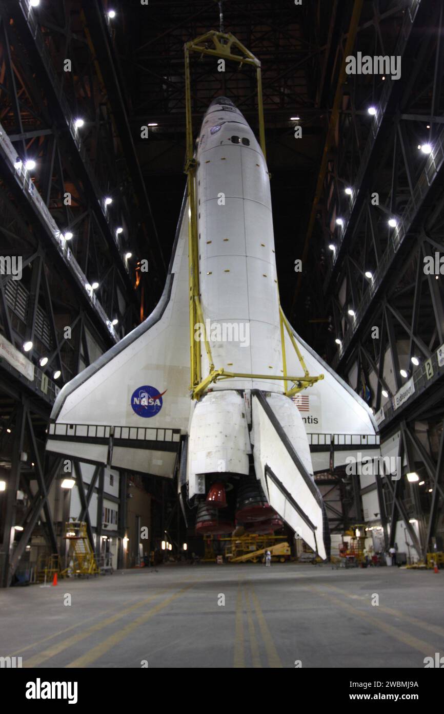 Space Shuttle Atlantis hangs vertically in the Vehicle Assembly ...