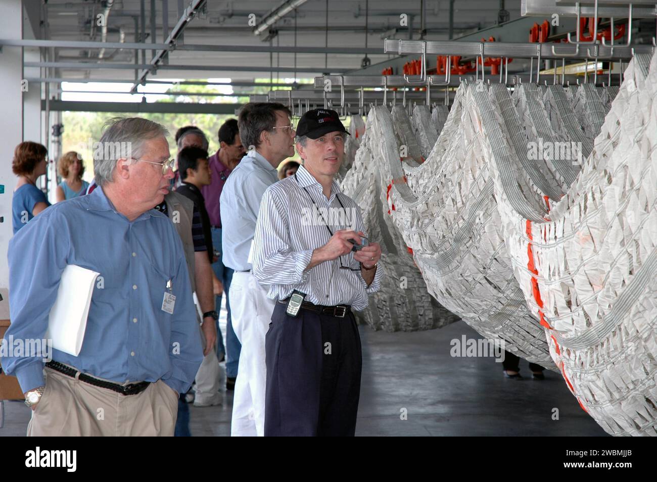 KENNEDY SPACE CENTER, FLA. - The media tour the Parachute Refurbishment ...