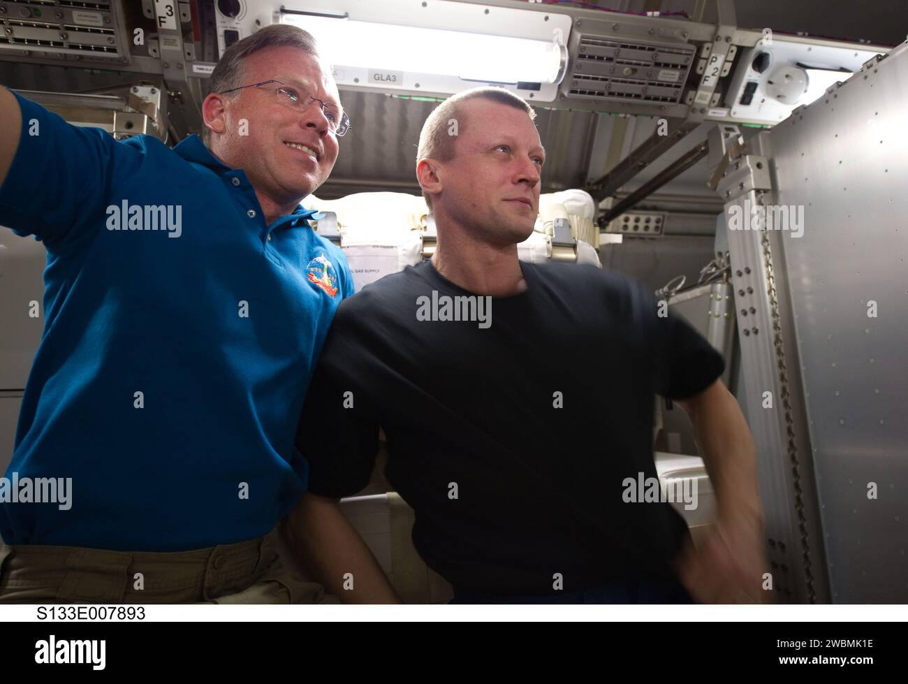 S133-E-007893 (1 March 2011) --- NASA astronaut Steve Lindsey (left ...