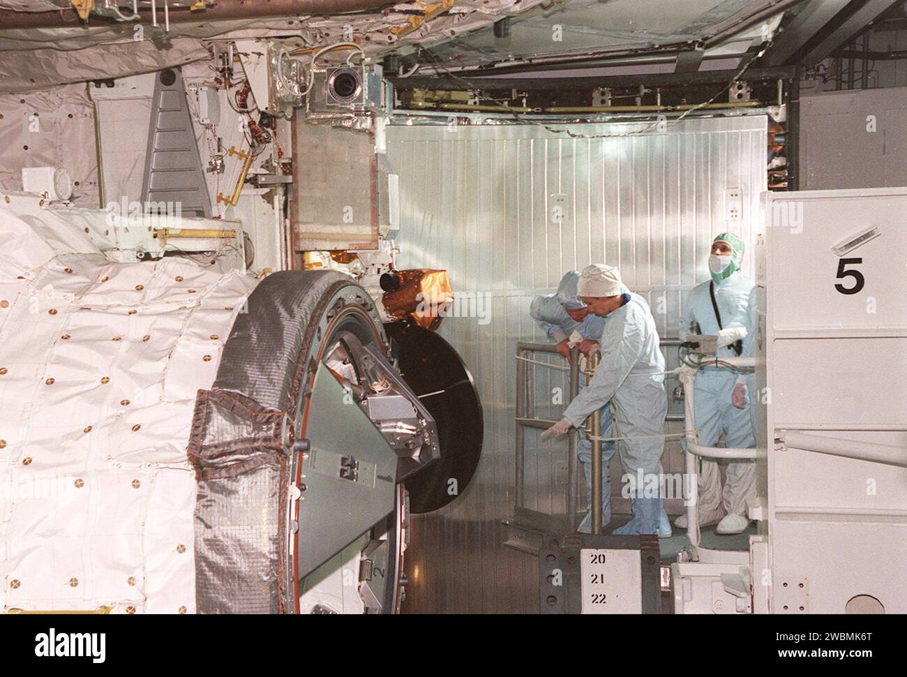 KENNEDY SPACE CENTER, FLA. -- STS-98 Mission Specialist Marsha Ivins (center, pointing) checks ...