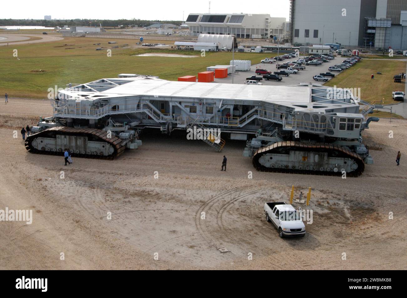 KENNEDY SPACE CENTER, FLA. - Observers walk alongside the newly shod ...