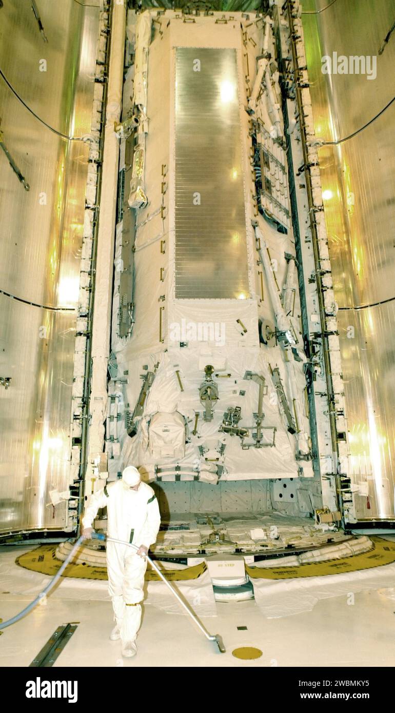At Launch Pad 39B, a worker prepares to close Space Shuttle Atlantis ...