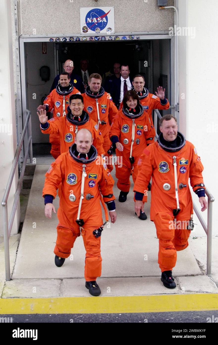 KENNEDY SPACE CENTER, Fla. - The STS-108 and Expedition 4 crews stride ...