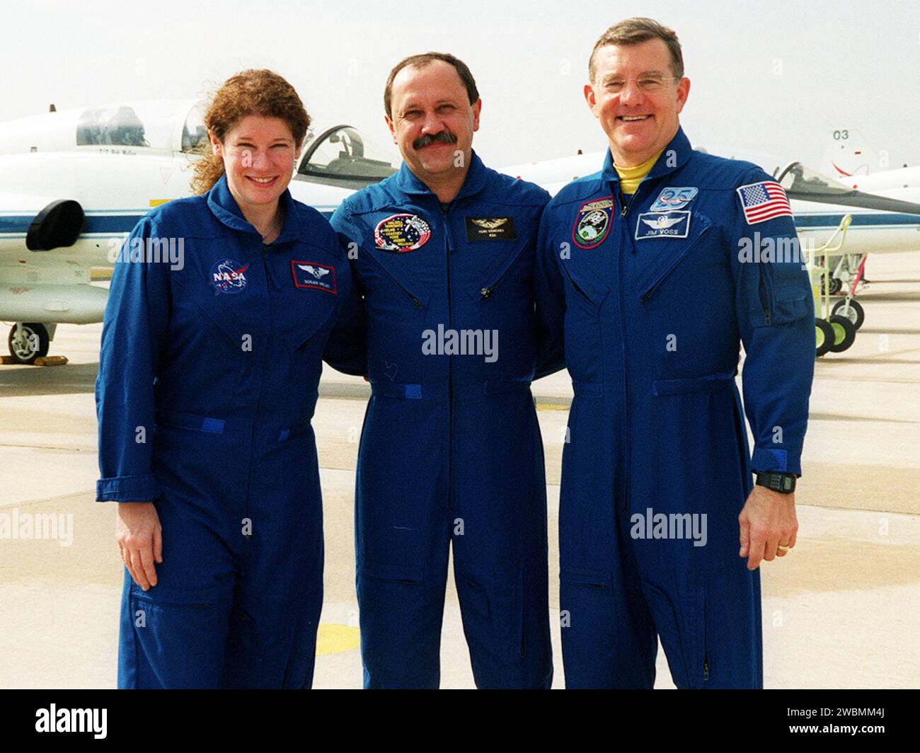 The three members of the Expedition Two crew arrive at KSC. Standing ...