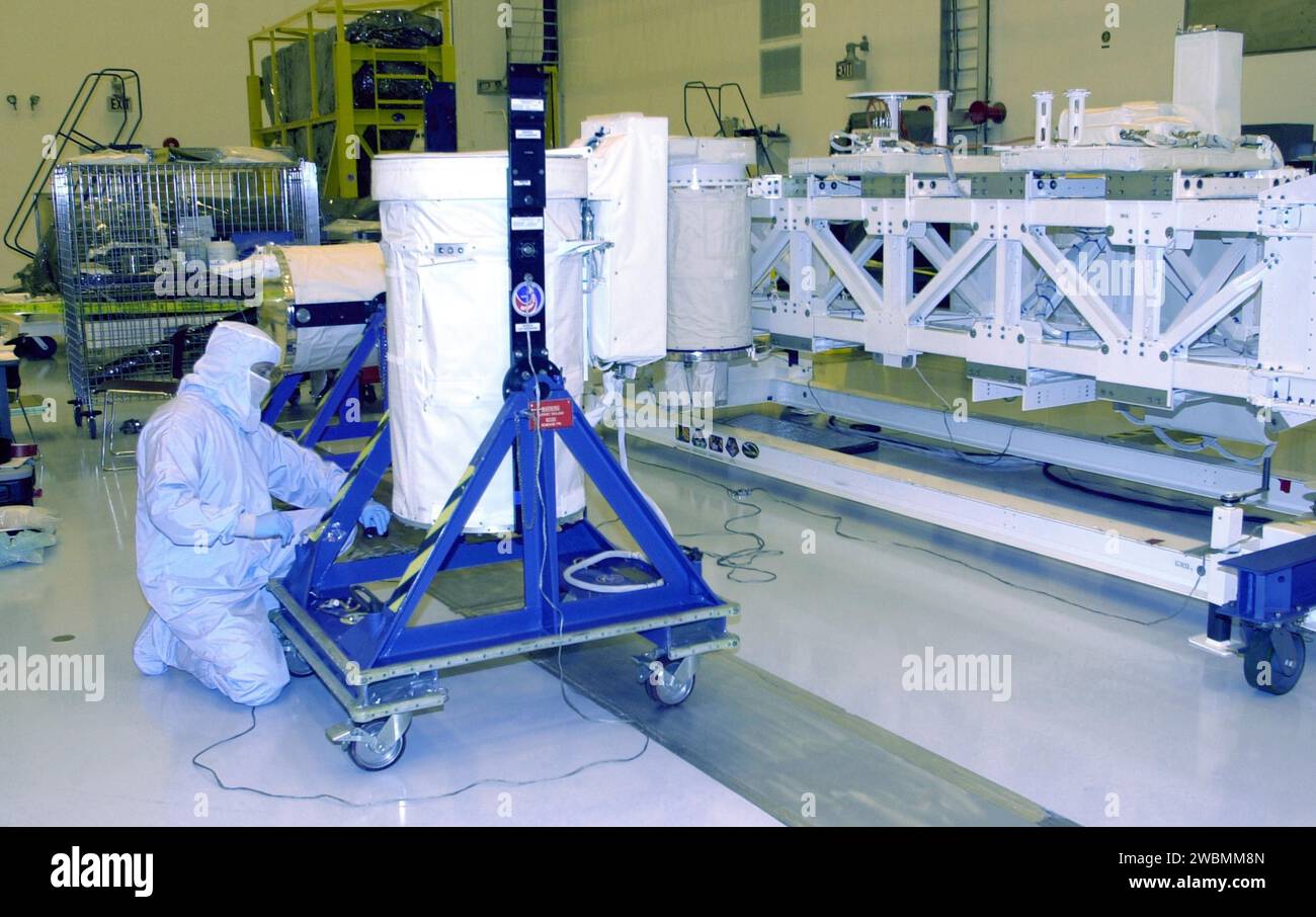KENNEDY SPACE CENTER, FLA. -- A worker in the Multi-Payload Processing ...