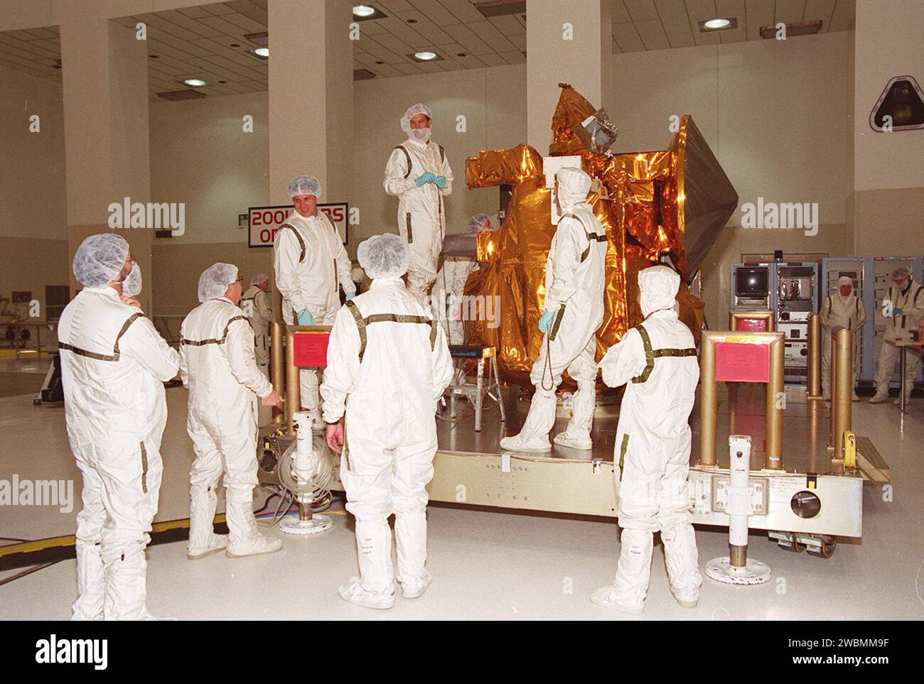 Workers in the Space Assembly and Encapsulation Building 2 prepare to ...