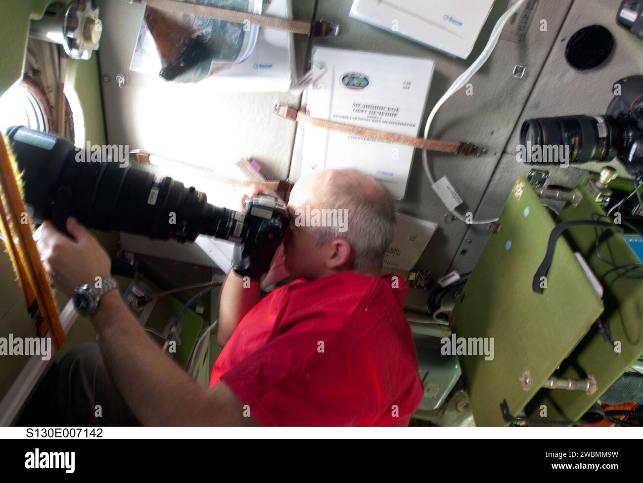 NASA astronaut Jeffrey Williams, Expedition 22 commander, uses a still ...