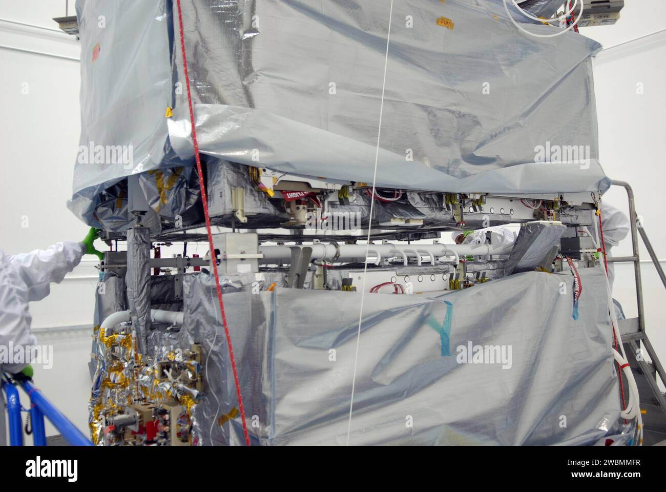 At Astrotech facility in Titusville, Florida, SV1 spacecraft is lowered ...