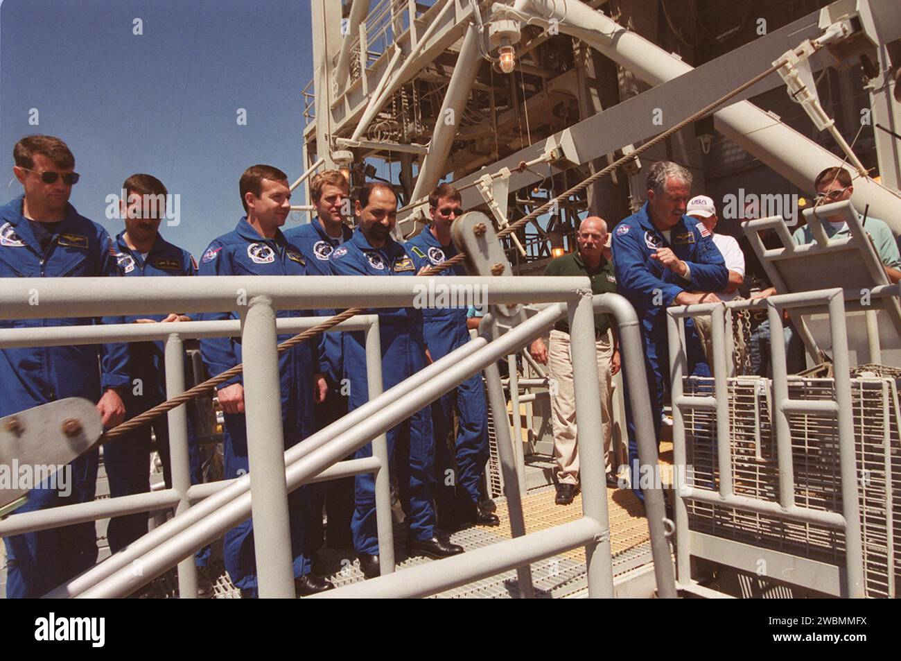 KENNEDY SPACE CENTER, FLA. -- The STS-100 crew gathers on the 195-foot ...