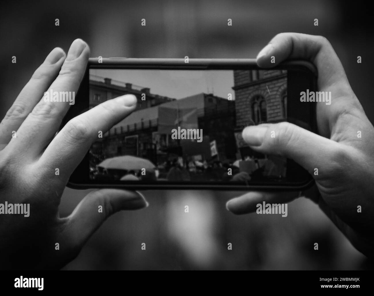 Photographing with mobile phone Black and White Stock Photos & Images ...