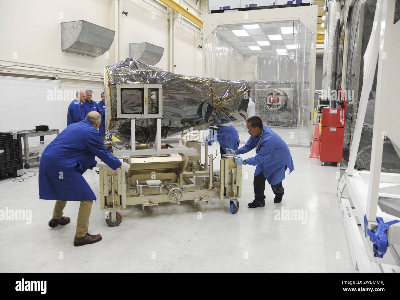 VANDENBERG AFB, Calif. – Technicians move NASA's IRIS spacecraft at ...