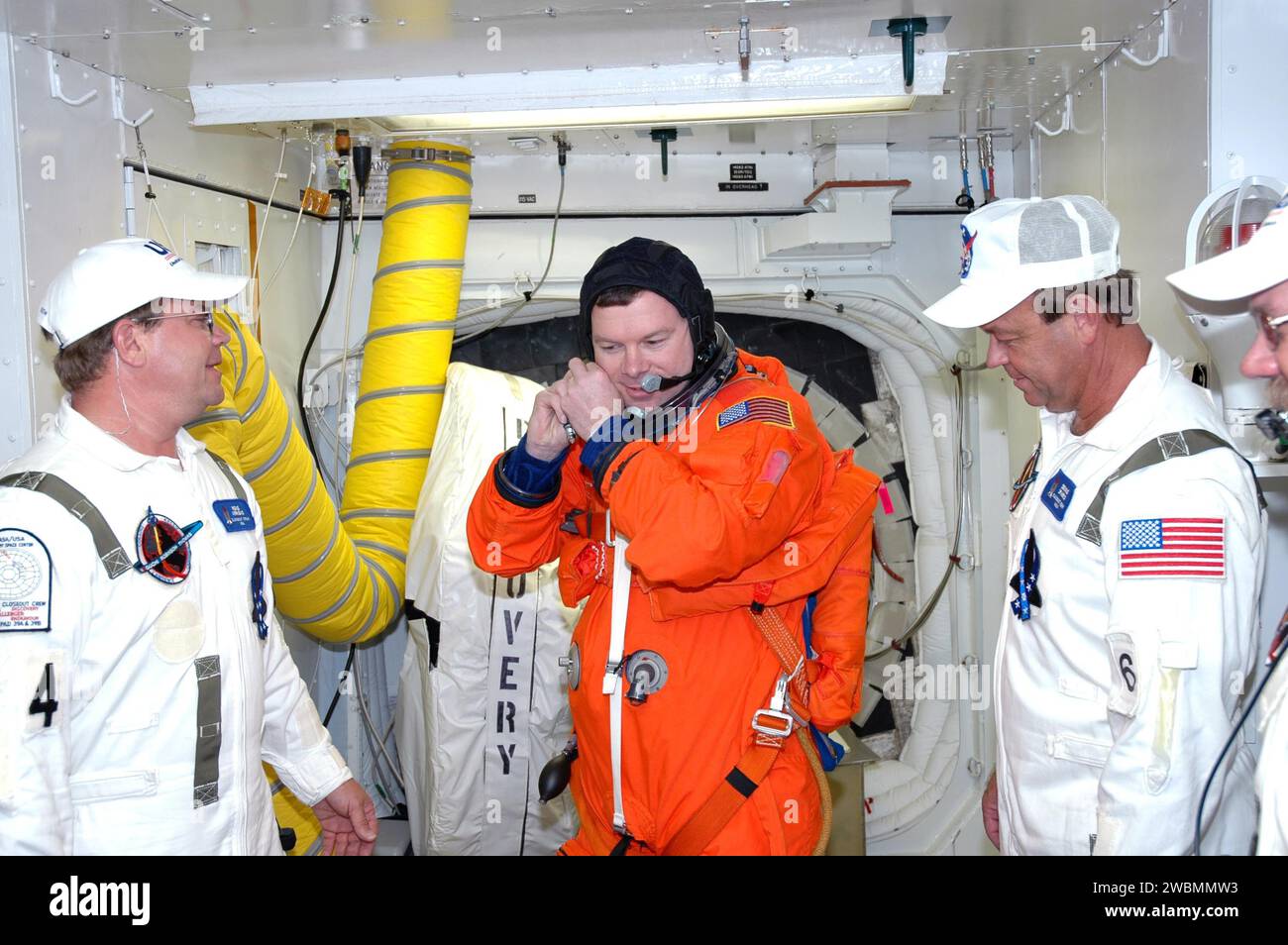 KENNEDY SPACE CENTER, FLA. - With the Closeout Crew looking on in the White Room on Launch Pad ...