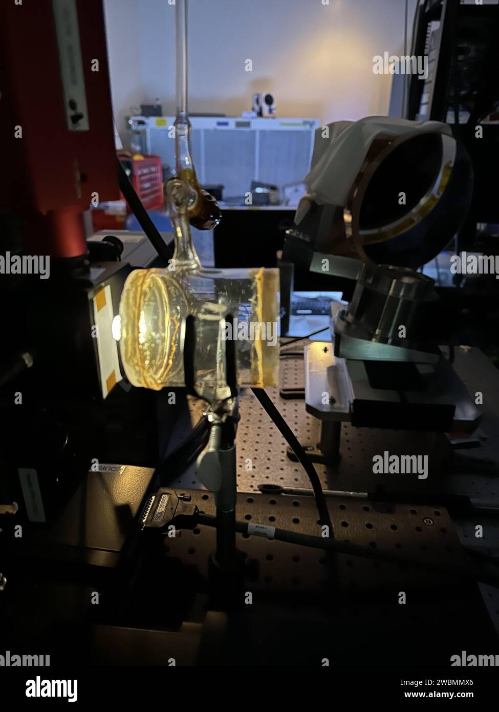 Methane, a potent greenhouse gas, is contained in a glowing cylinder ...