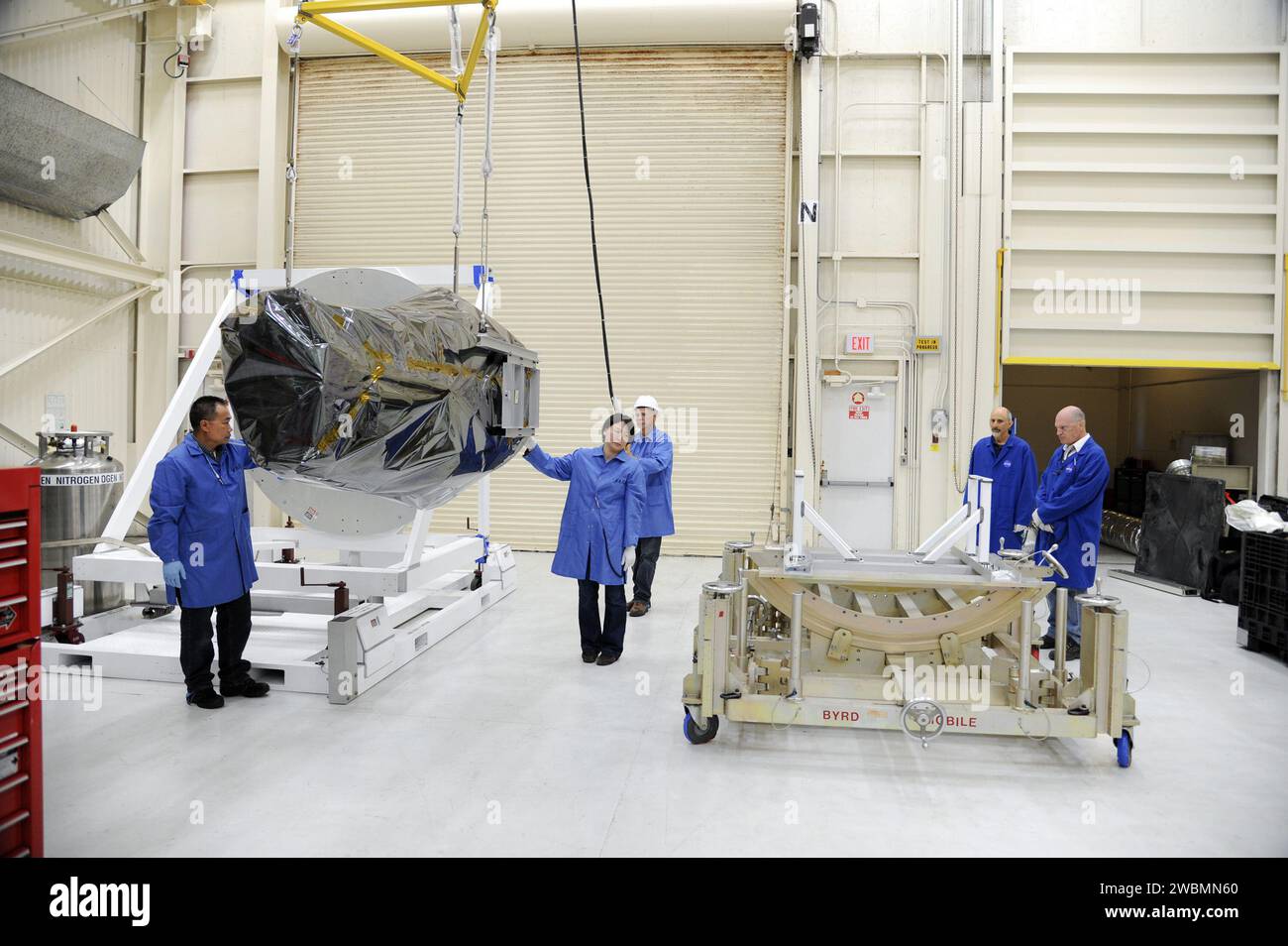 VANDENBERG AFB, Calif. – Technicians move NASA's IRIS spacecraft at ...