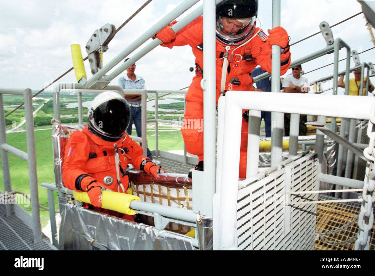 KENNEDY SPACE CENTER, Fla. -- STS-105 Pilot Rick Sturckow (left) waits ...