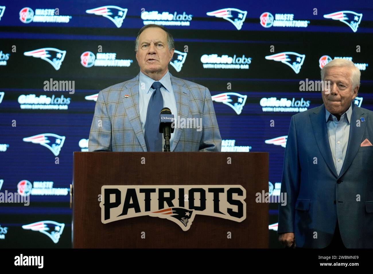 Former New England Patriots head coach Bill Belichick, left, faces reporters as Patriots team ...