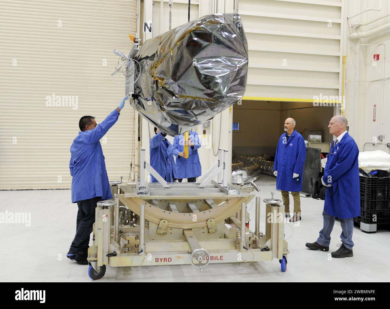 VANDENBERG AFB, Calif. – Technicians move NASA's IRIS spacecraft at ...