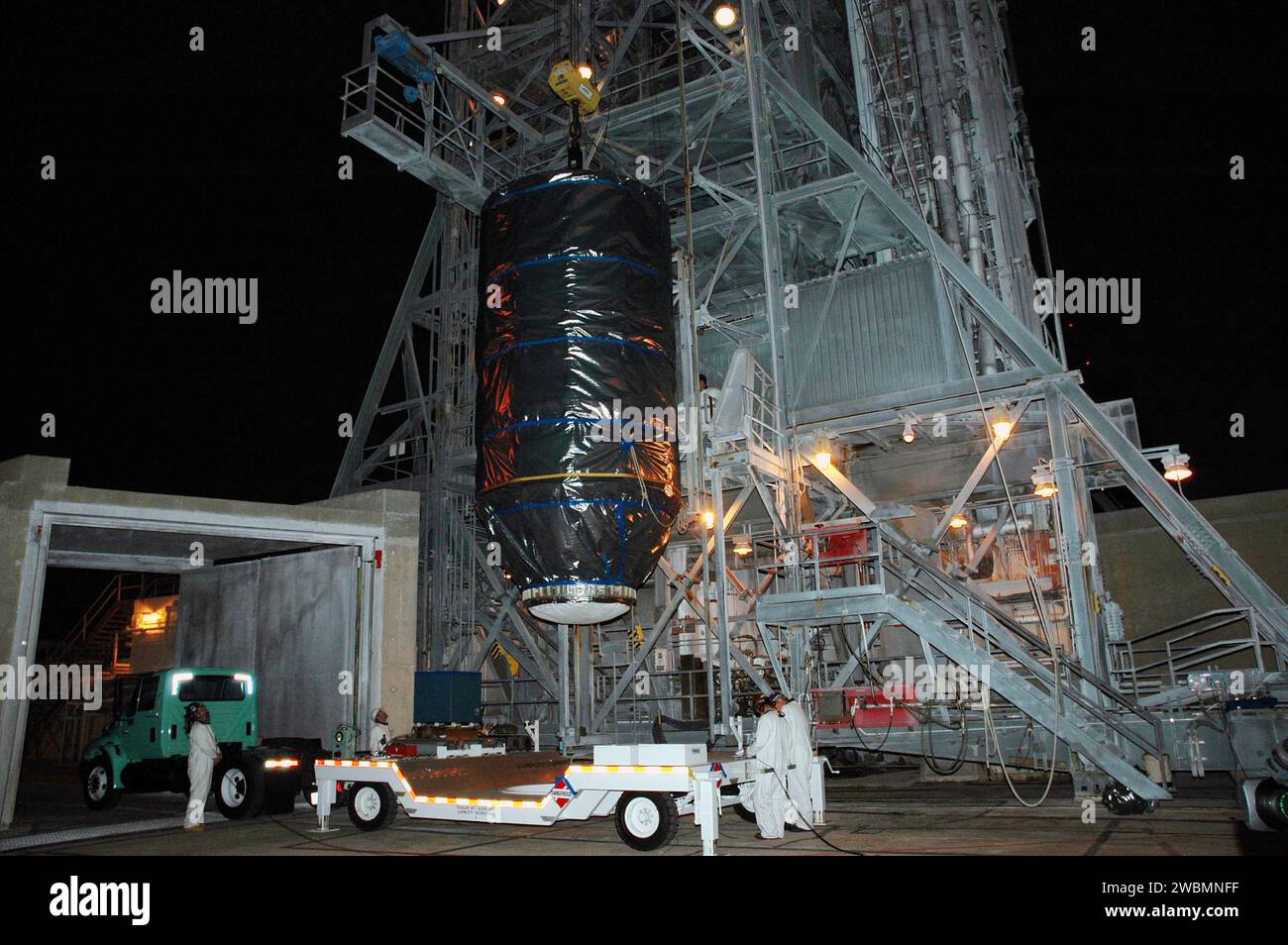 KENNEDY SPACE CENTER, FLA. - The Deep Impact spacecraft is lifted from ...