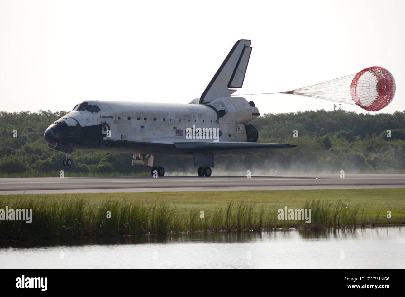 CAPE CANAVERAL, Fla. - With drag chute unfurled, space shuttle ...