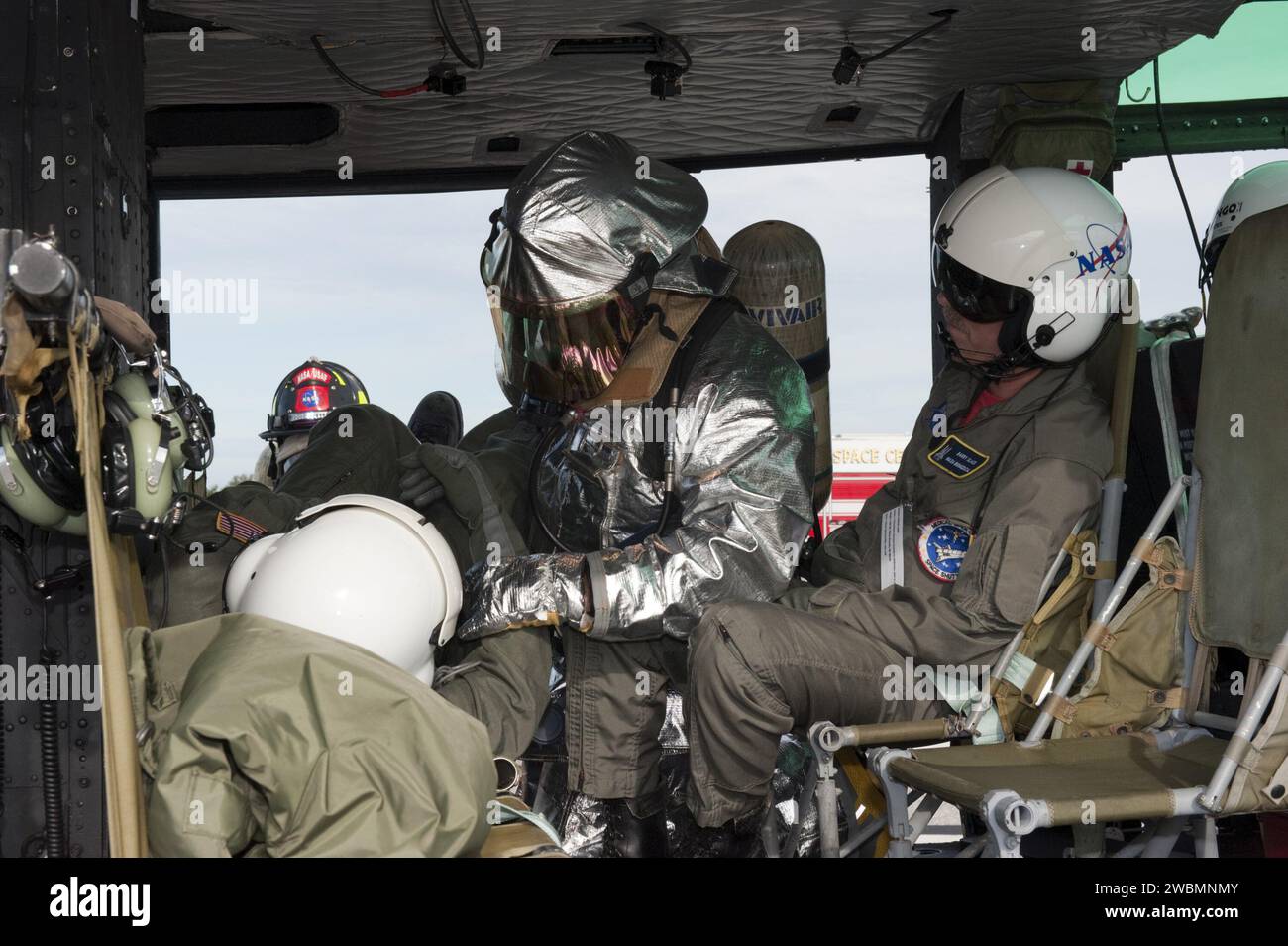 CAPE CANAVERAL, Fla. -- NASA Fire Rescue personnel assist volunteers ...