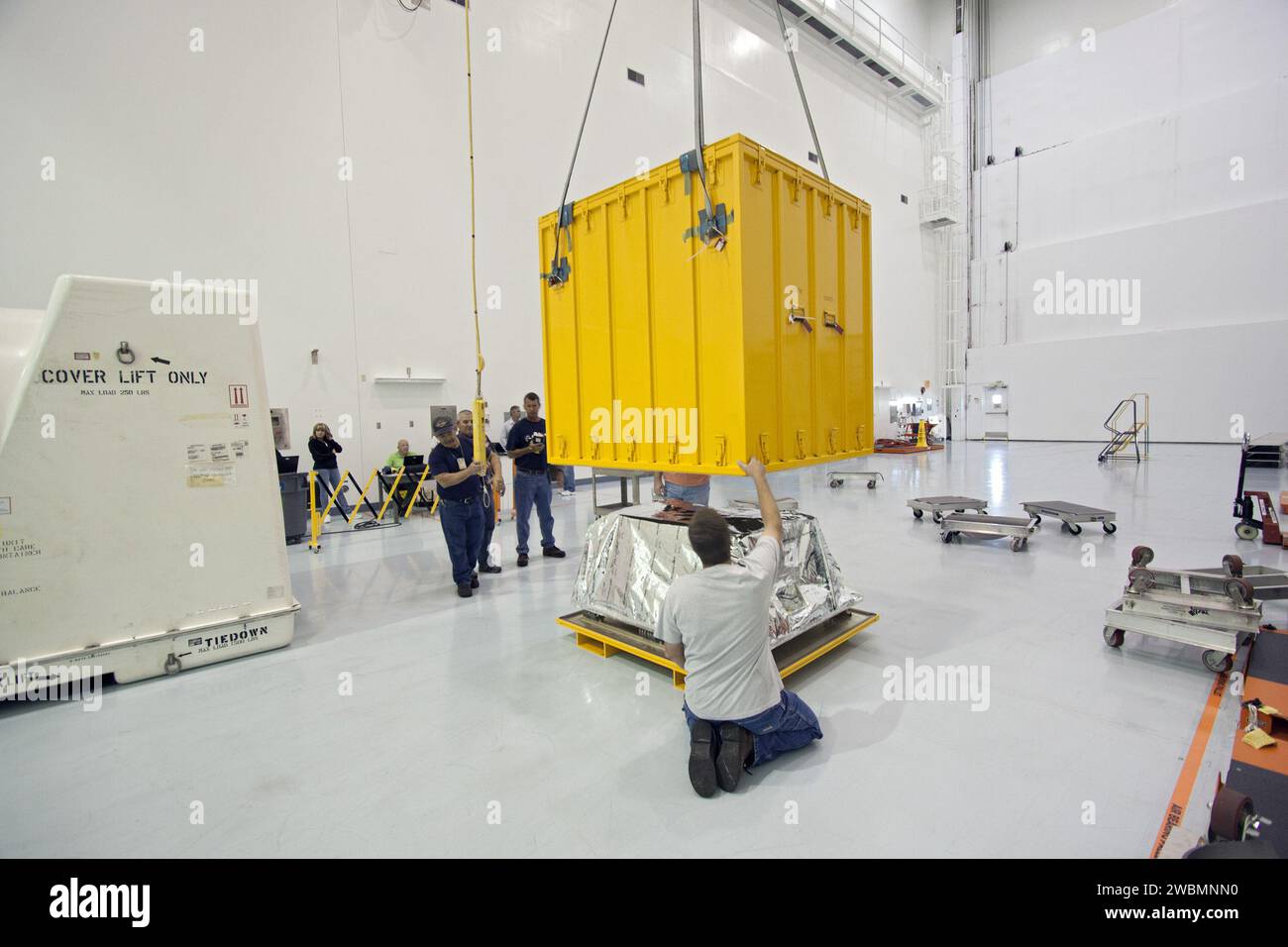 Technicians at Kennedy Space Center’s Space Station Processing Facility ...