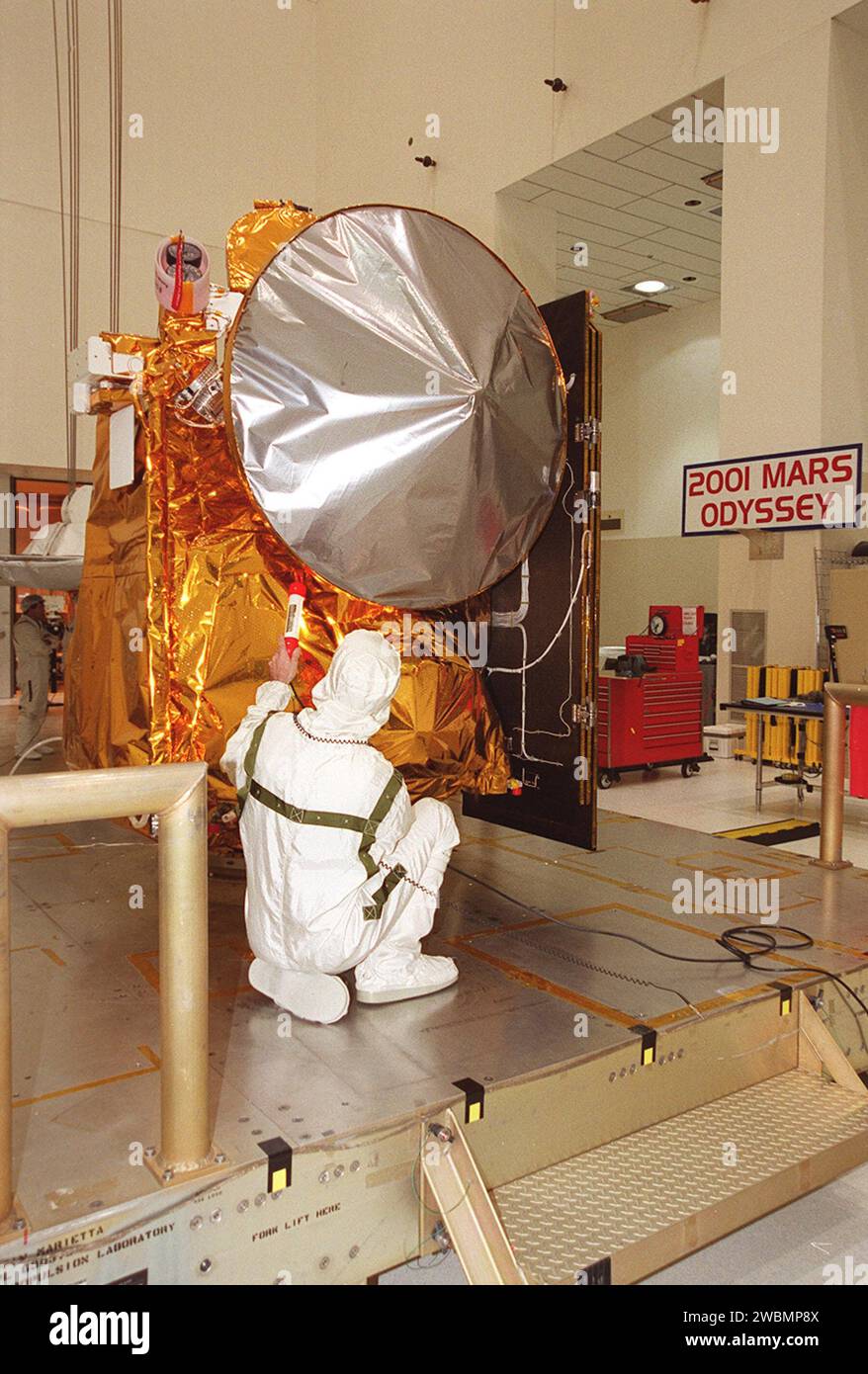 A worker in the Space Assembly and Encapsulation Facility 2 checks out ...