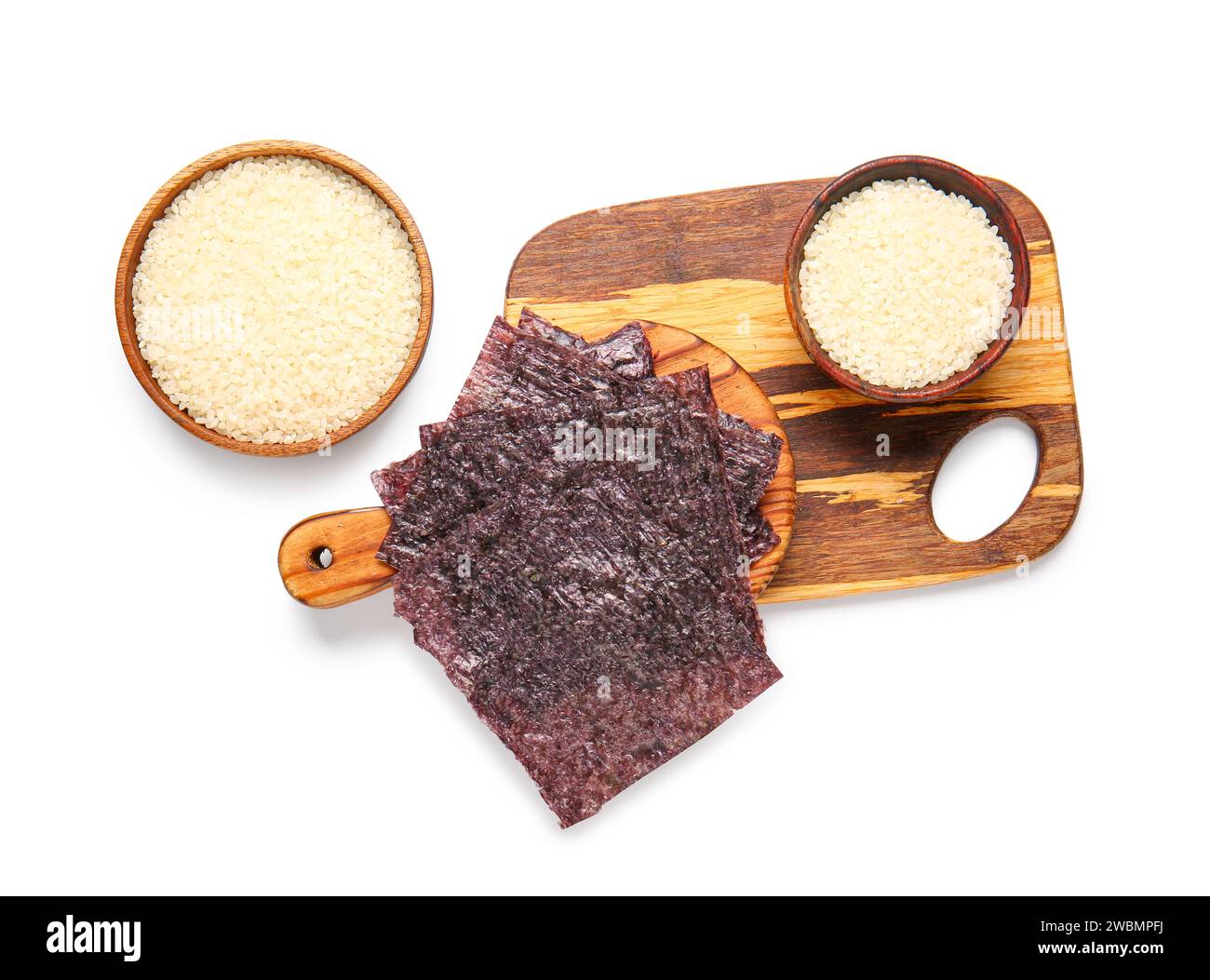 Wooden boards with natural nori sheets and bowls of rice isolated on ...