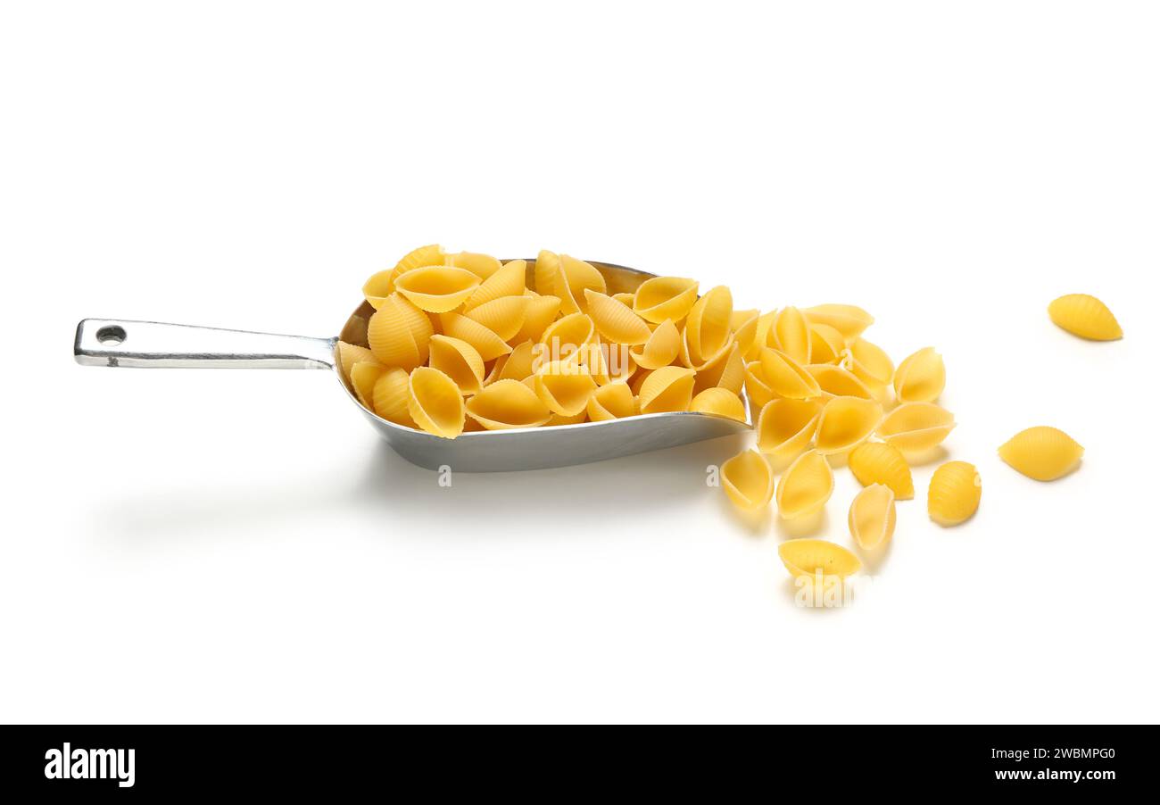 Scoop of raw conchiglie pasta isolated on white background Stock Photo ...