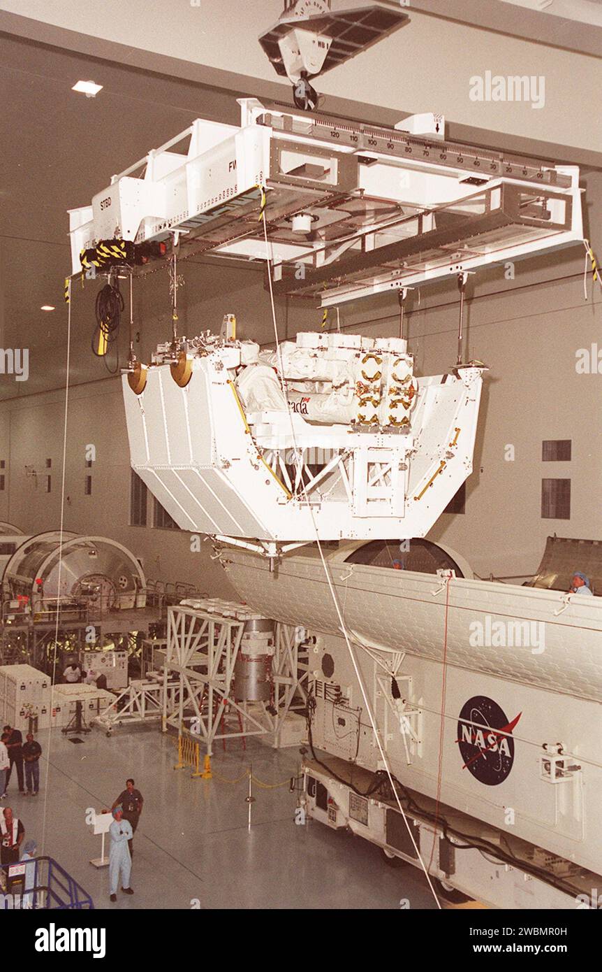 In the Space Station Processing Facility, the overhead crane rolls ...