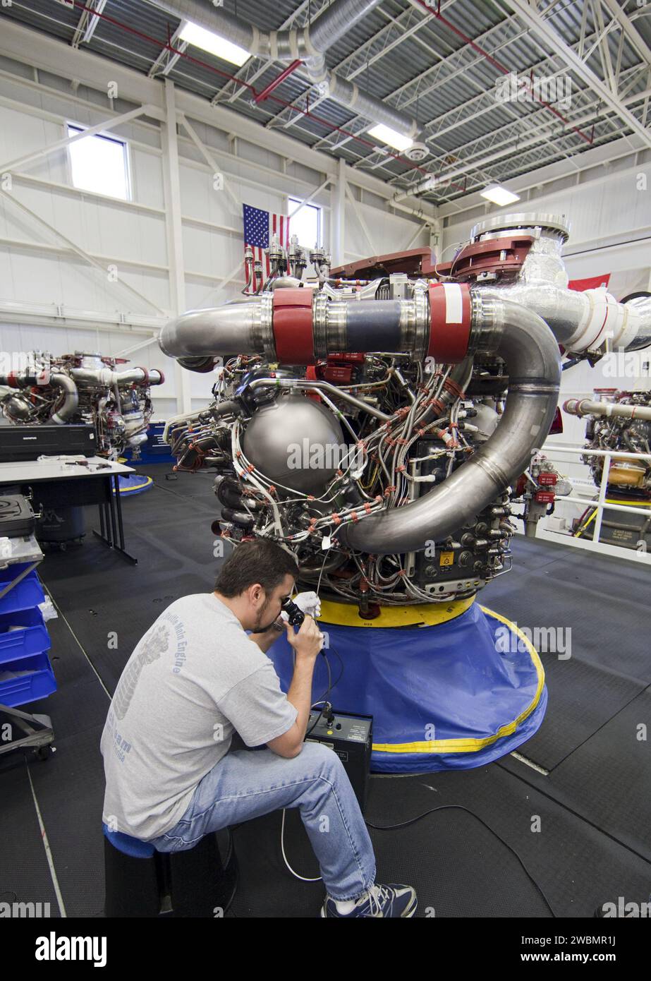 A technician performs a boroscope inspection on a high-pressure ...