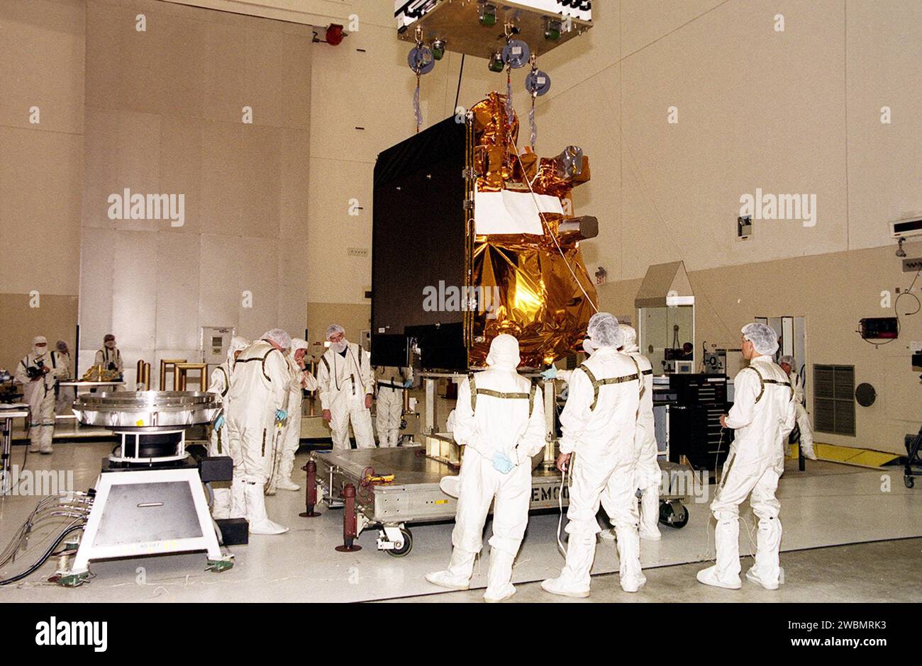 The 2001 Mars Odyssey Orbiter, suspended by an overhead crane in the ...