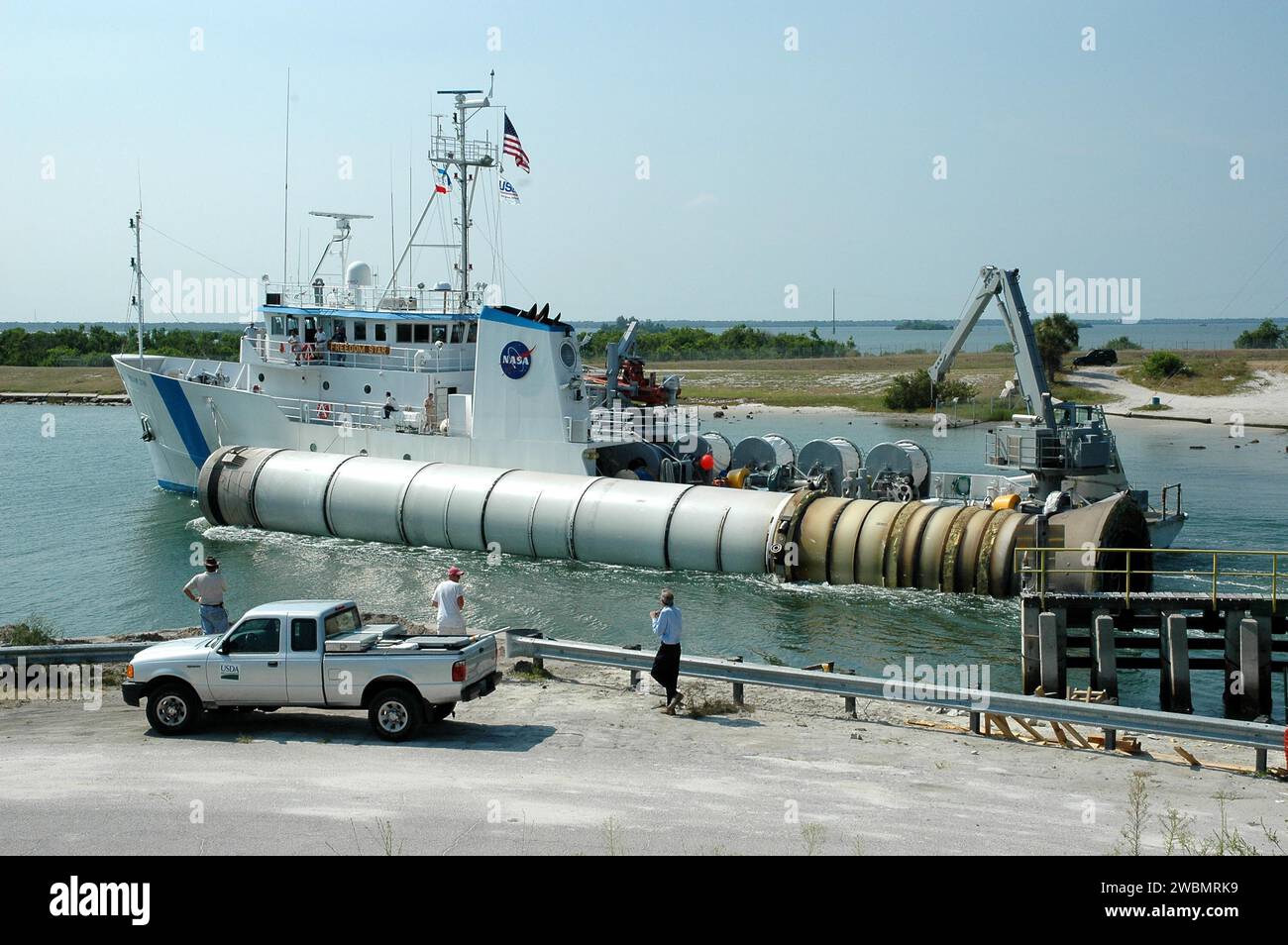 KENNEDY SPACE CENTER, FLA. - Photographers capture the solid rocket ...