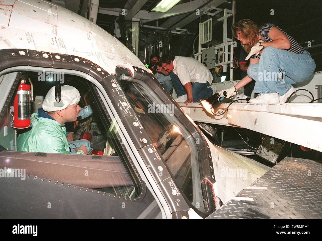 In the Orbiter Processing Facility bay 1, STS-102 Pilot James W. Kelly ...
