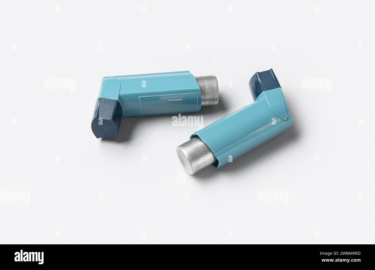 Asthma inhalers on grey background Stock Photo - Alamy