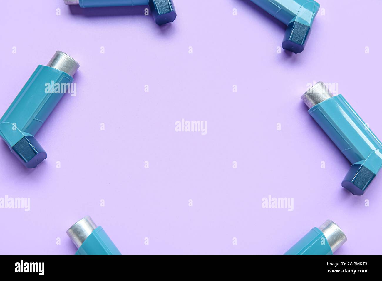 Frame made of asthma inhalers on lilac background Stock Photo - Alamy