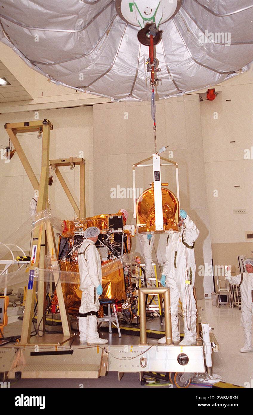 An overhead crane moves The Gamma Ray Spectrometer (GRS) into place to ...