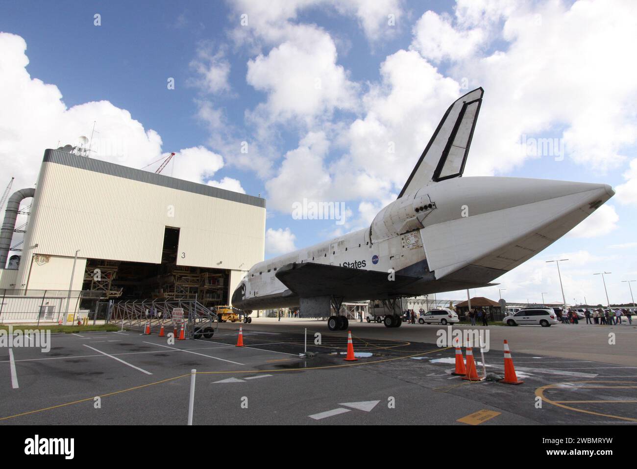 CAPE CANAVERAL, Fla. – Space shuttle Discovery is towed toward the open ...
