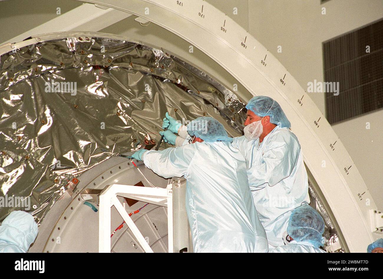 KENNEDY SPACE CENTER, FLA. -- Workers in the Space Station Processing ...