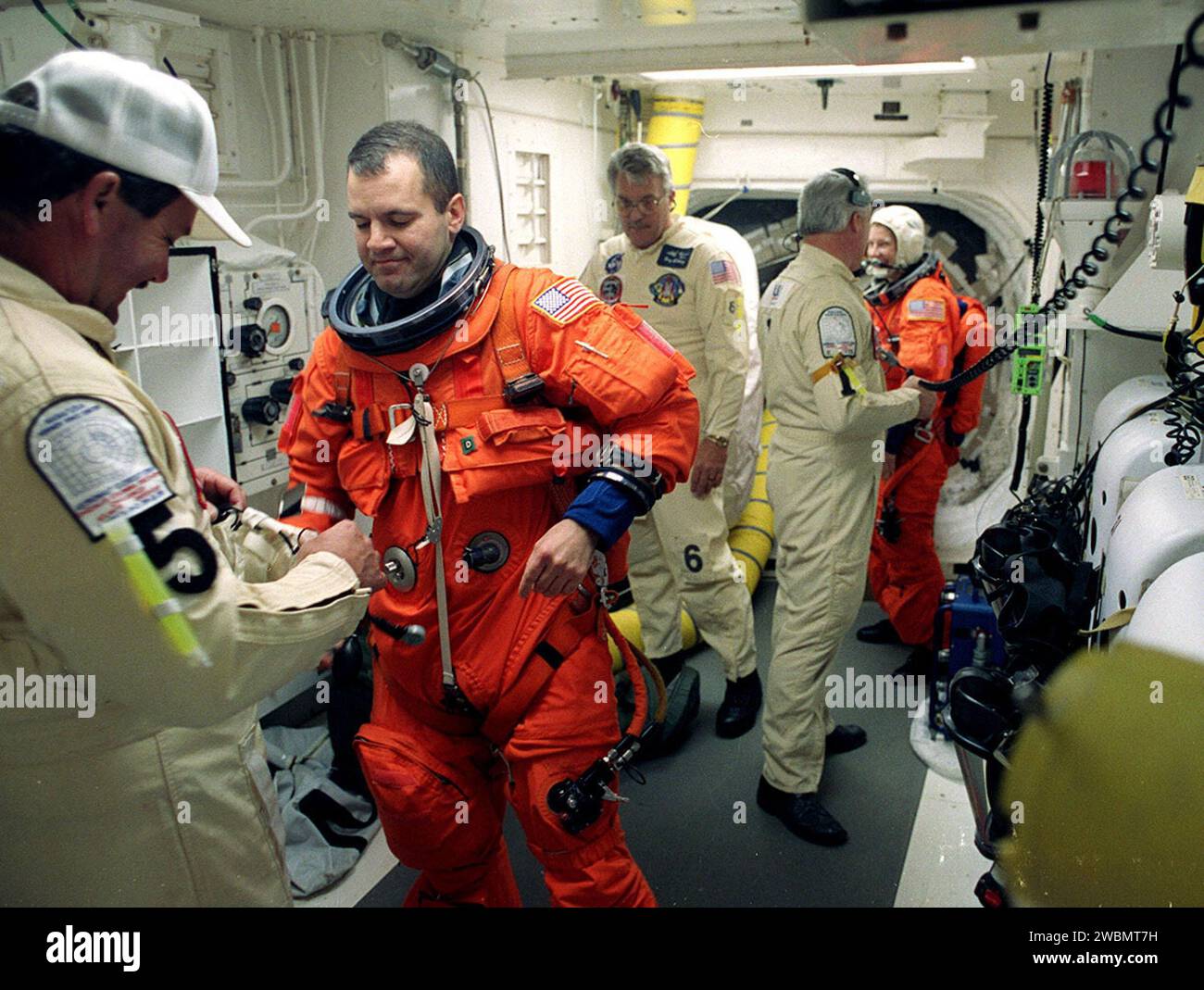 Technicians in the White Room, Launch Pad 39B, help STS-102 Mission ...