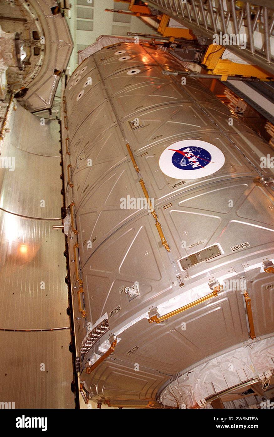 The U.S. Lab Destiny begins moving out of Atlantis’ payload bay and into the Payload Changeout ...