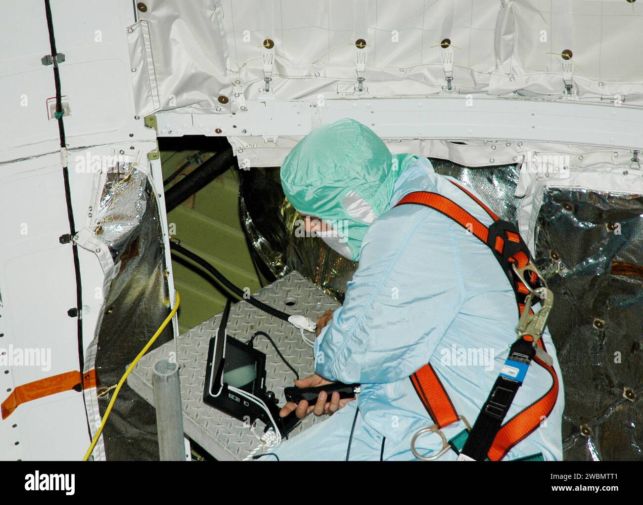 KENNEDY SPACE CENTER, FLA. - At Launch Complex 39B, a technician in ...