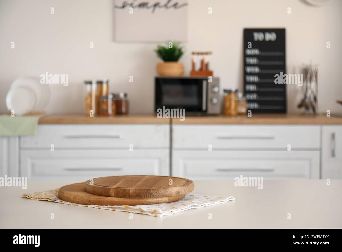 Wooden cutting boards on table in modern kitchen Stock Photo - Alamy