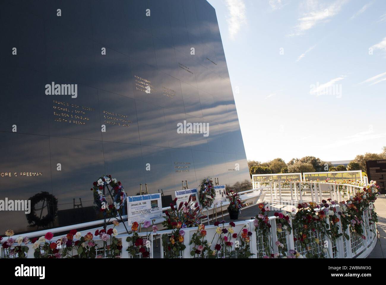 Kennedy Space Center employees and guests placed wreaths and flowers at ...