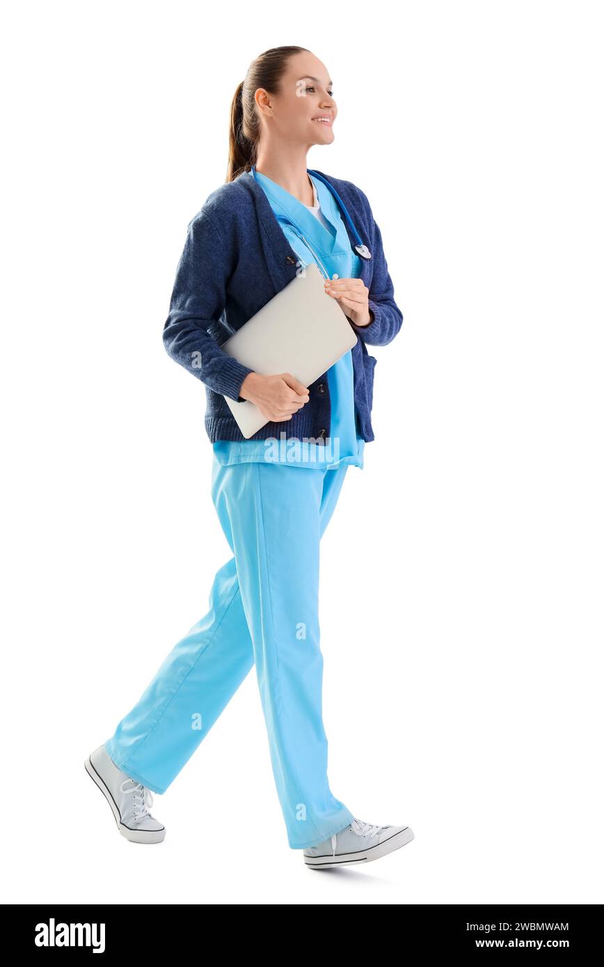Female medical intern with laptop on white background Stock Photo - Alamy