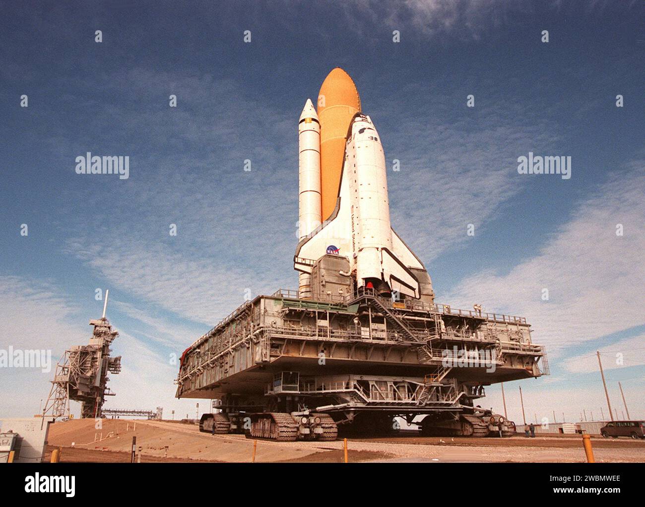 KENNEDY SPACE CENTER, Fla. -- Under wispy white clouds, Space Shuttle ...