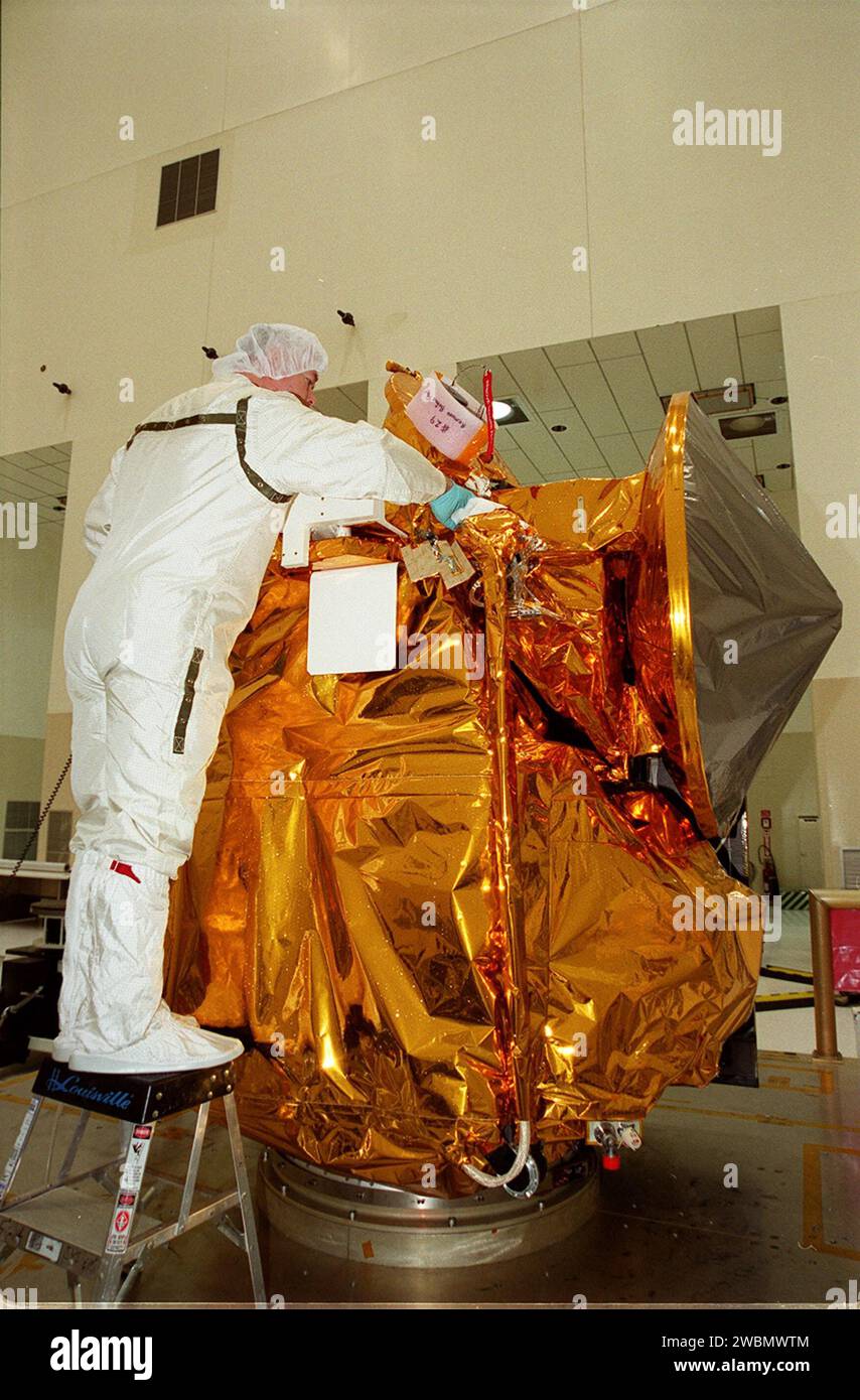 A worker in the Space Assembly and Encapsulation Facility 2 checks out ...