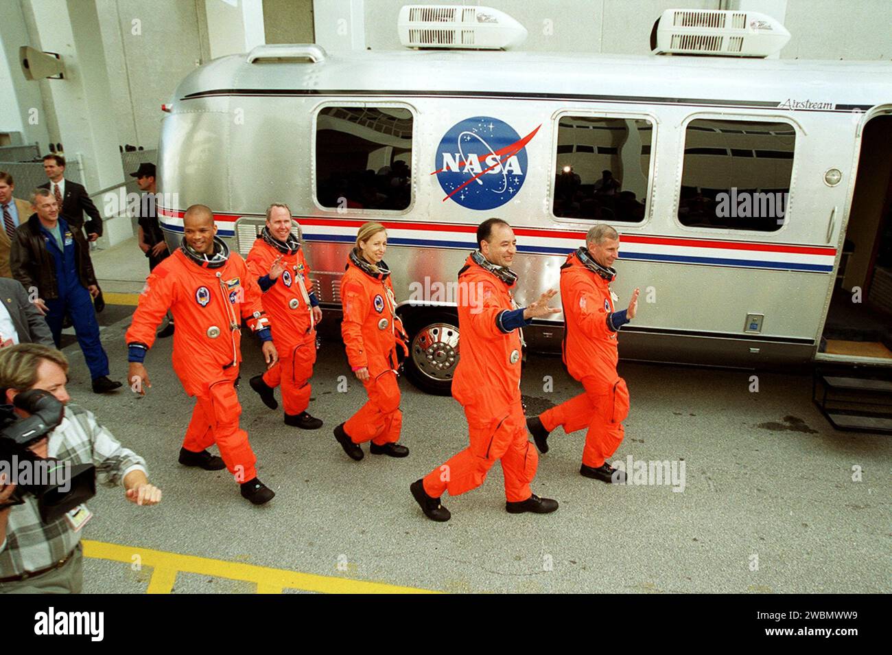 The STS-98 crew leaves the Operations and Checkout Building and heads ...
