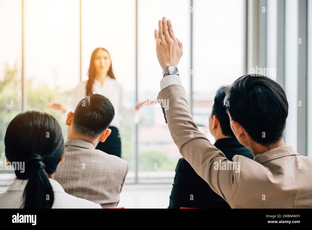 Meeting speaker hands raised hi-res stock photography and images - Alamy